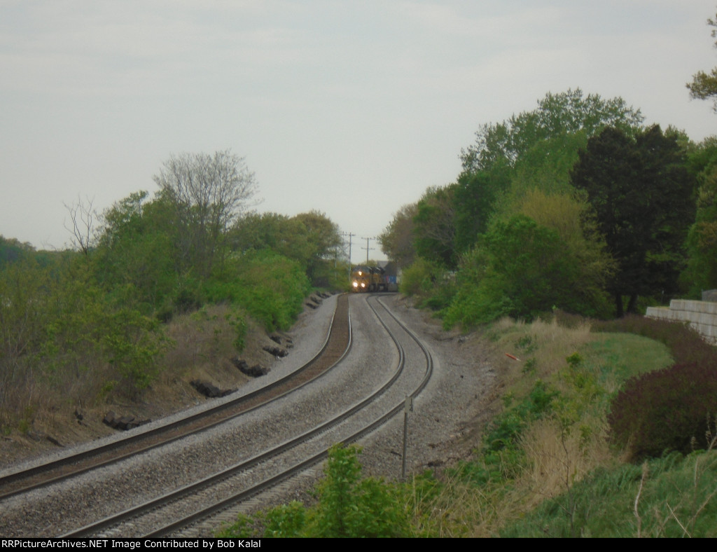 around the bend comes UP 6637 UP 8855 with UP 8557 UP 5982 bringing up the rear